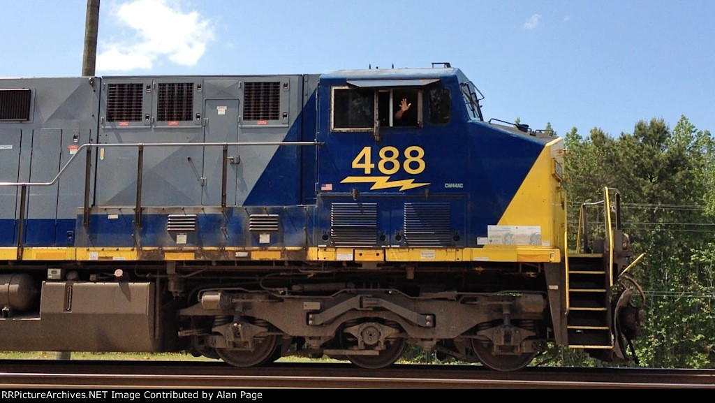 A friendly wave from the cab of CSX 488